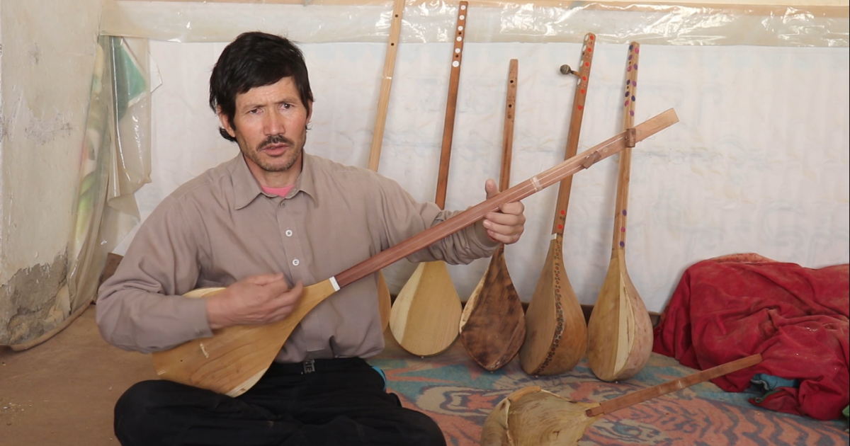 Pakistanis who make and play tamboura, a well-liked musical instrument ...